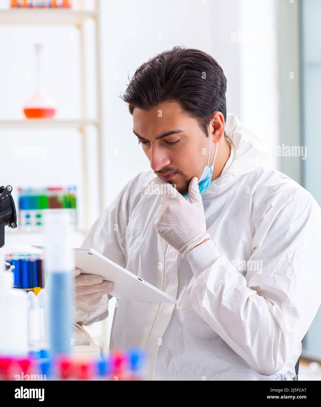 The young chemist student working in lab on chemicals Stock Photo - Alamy