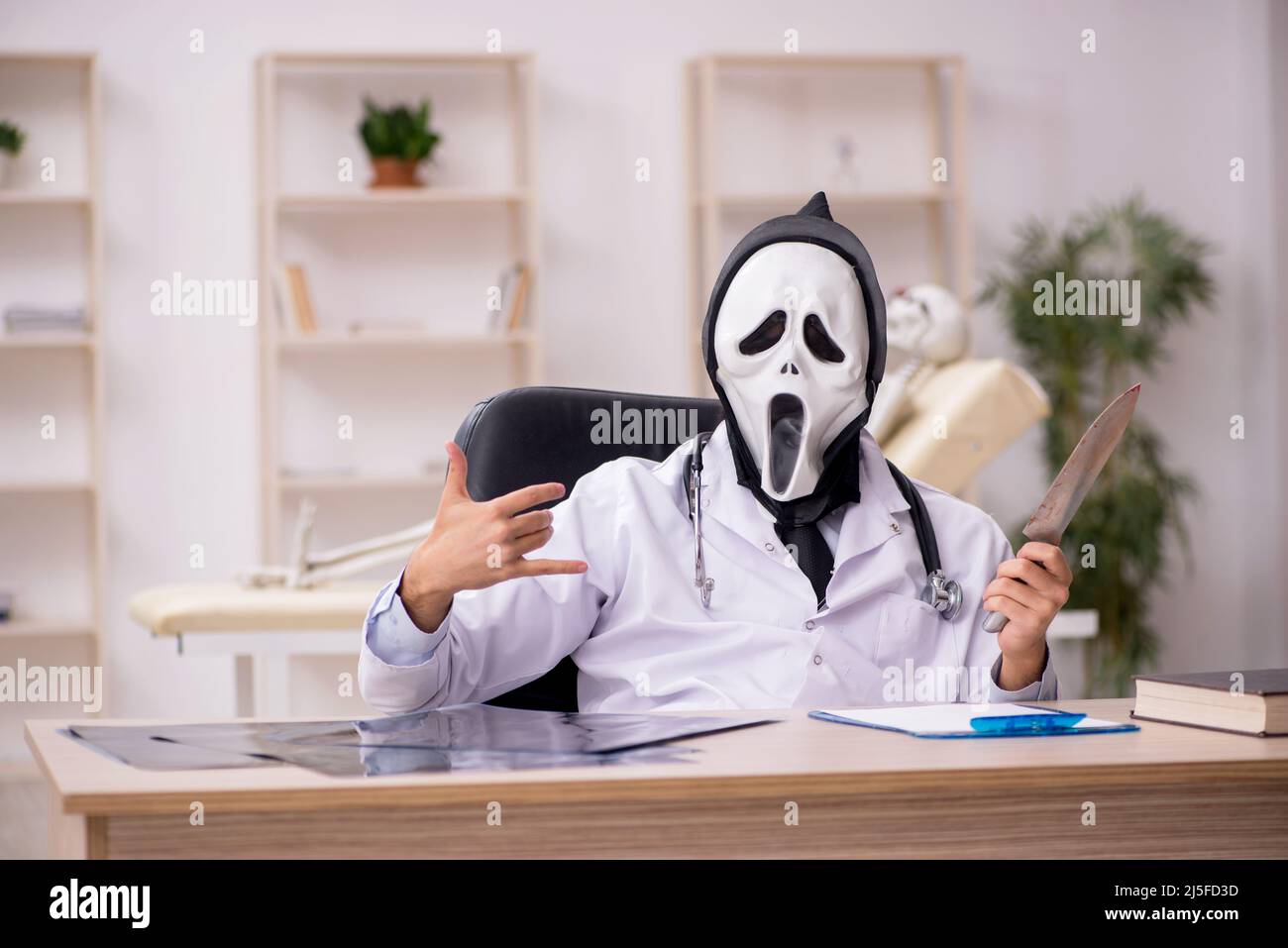 Devil doctor working at the hospital Stock Photo - Alamy