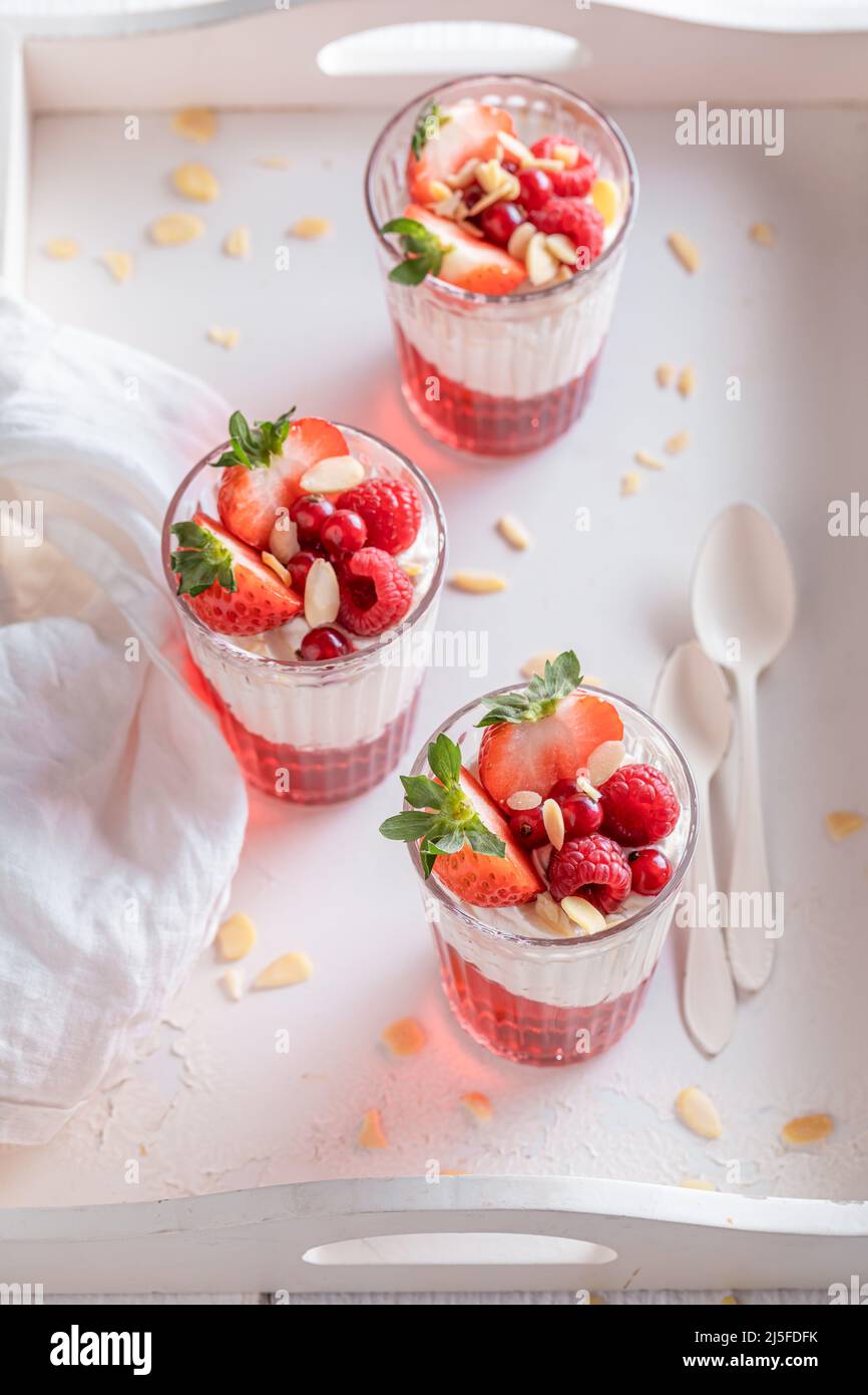 Homemade and tasty red jelly served with berries in glass. Berries ...