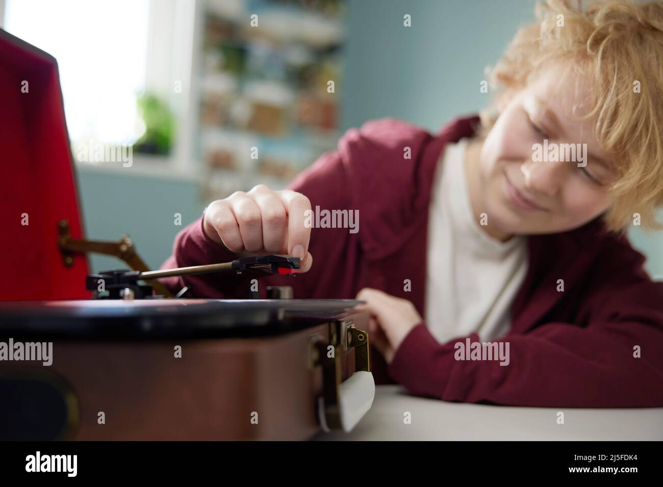 Teenage Girl Playing Vinyl Records On Record Player At Home In Bedroom ...