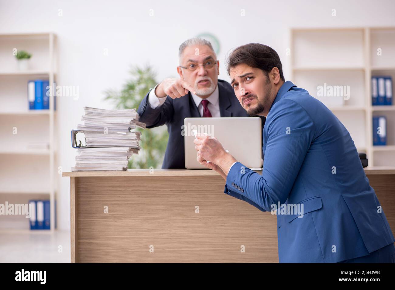 Two employees in dismissal concept Stock Photo - Alamy