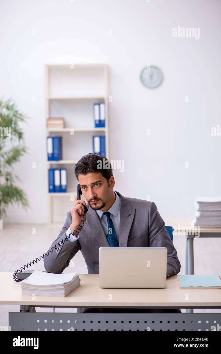 Two male employees working in the office Stock Photo - Alamy