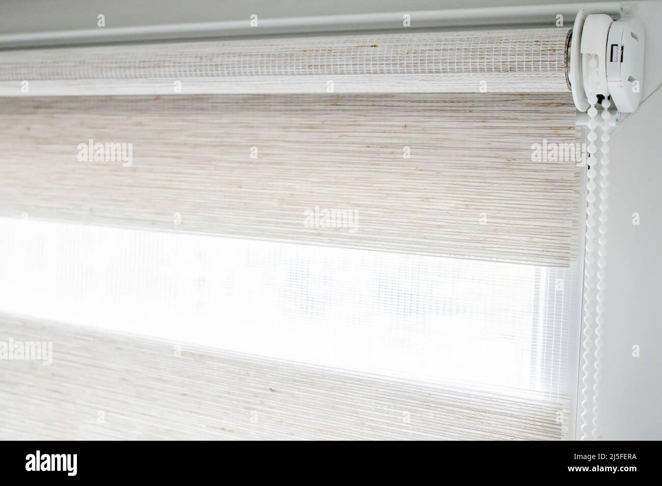 Window roller duo system day and night. Close up on roll curtains ...