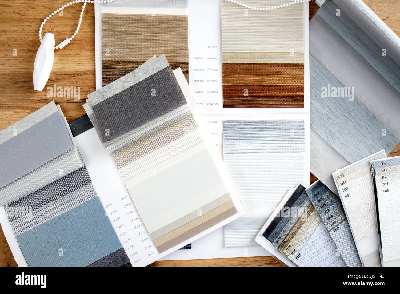 Samples of fabrics of different textures and colors in the form of a ...