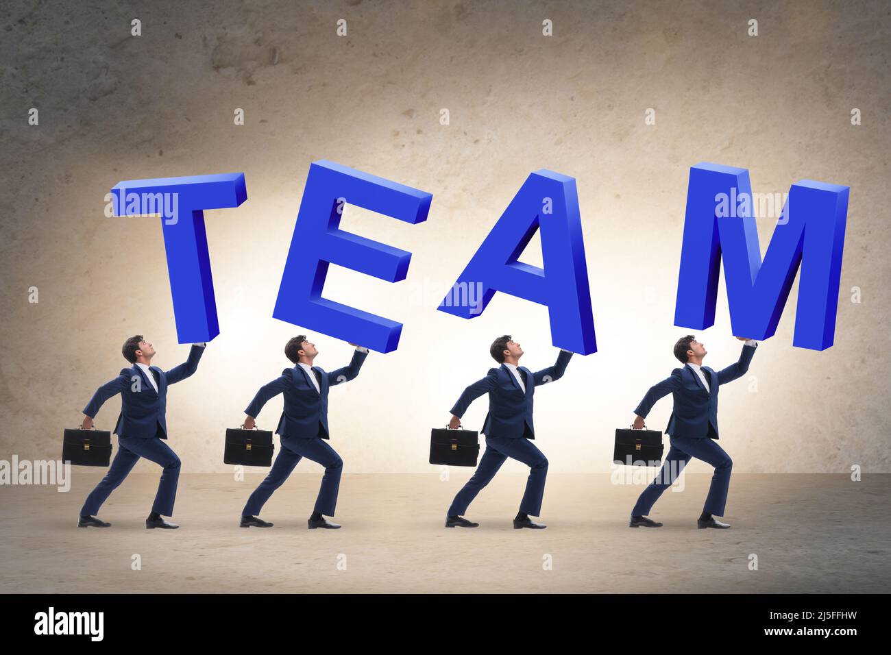 Teamwork concept with the people carrying team letters Stock Photo - Alamy