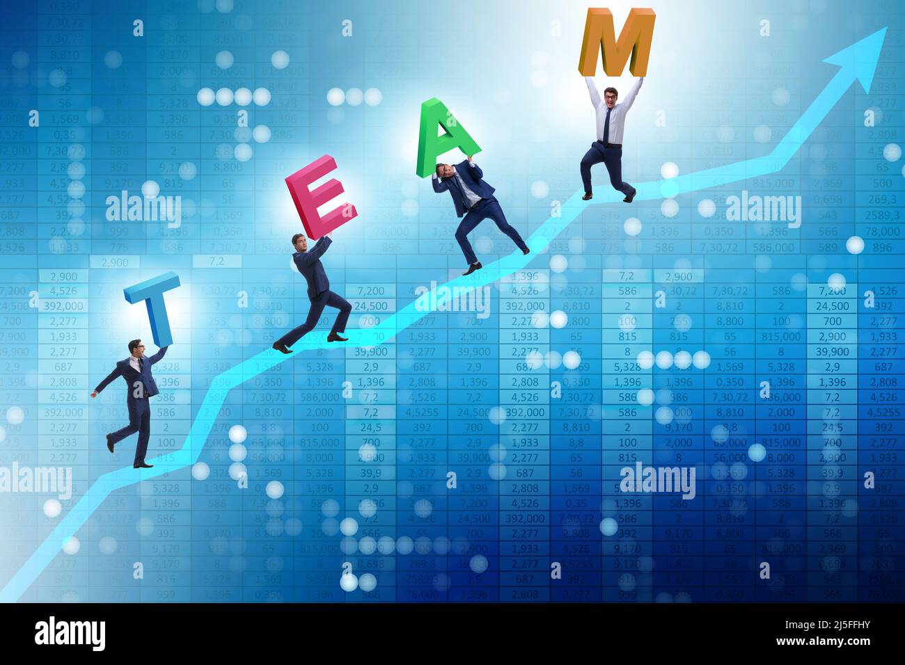 Teamwork concept with the people carrying team letters Stock Photo - Alamy