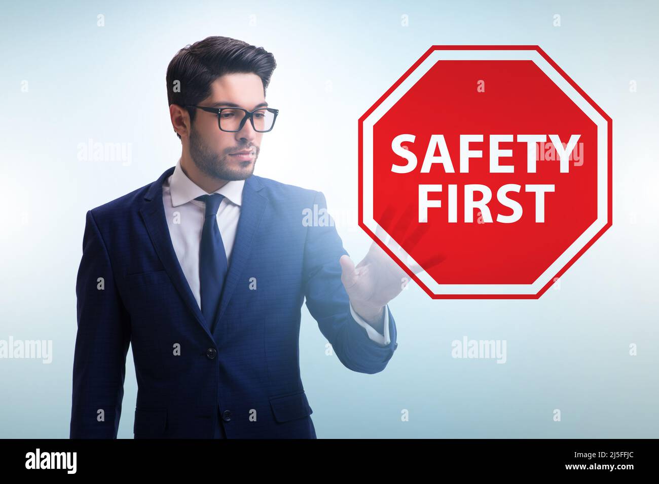 Safety first concept with the businessman Stock Photo - Alamy