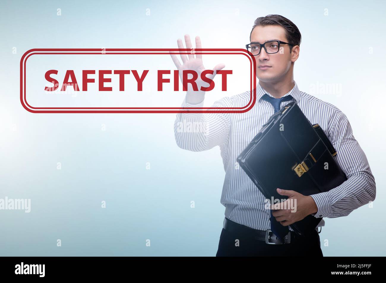 Safety first concept with the businessman Stock Photo - Alamy