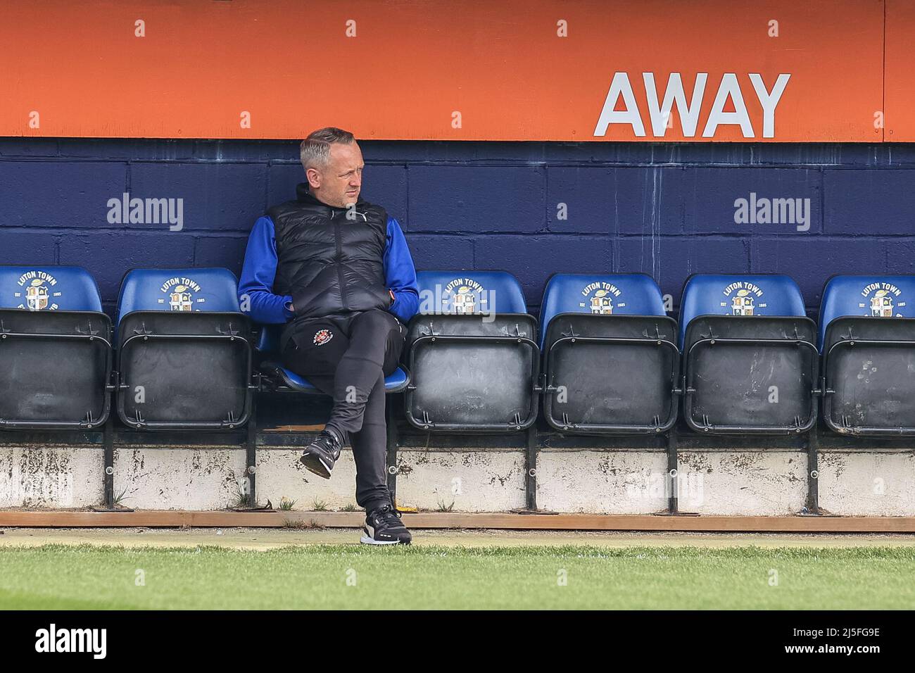 Luton, UK. 23rd Apr, 2022. Neil Critchley head coach of Blackpool sits ...