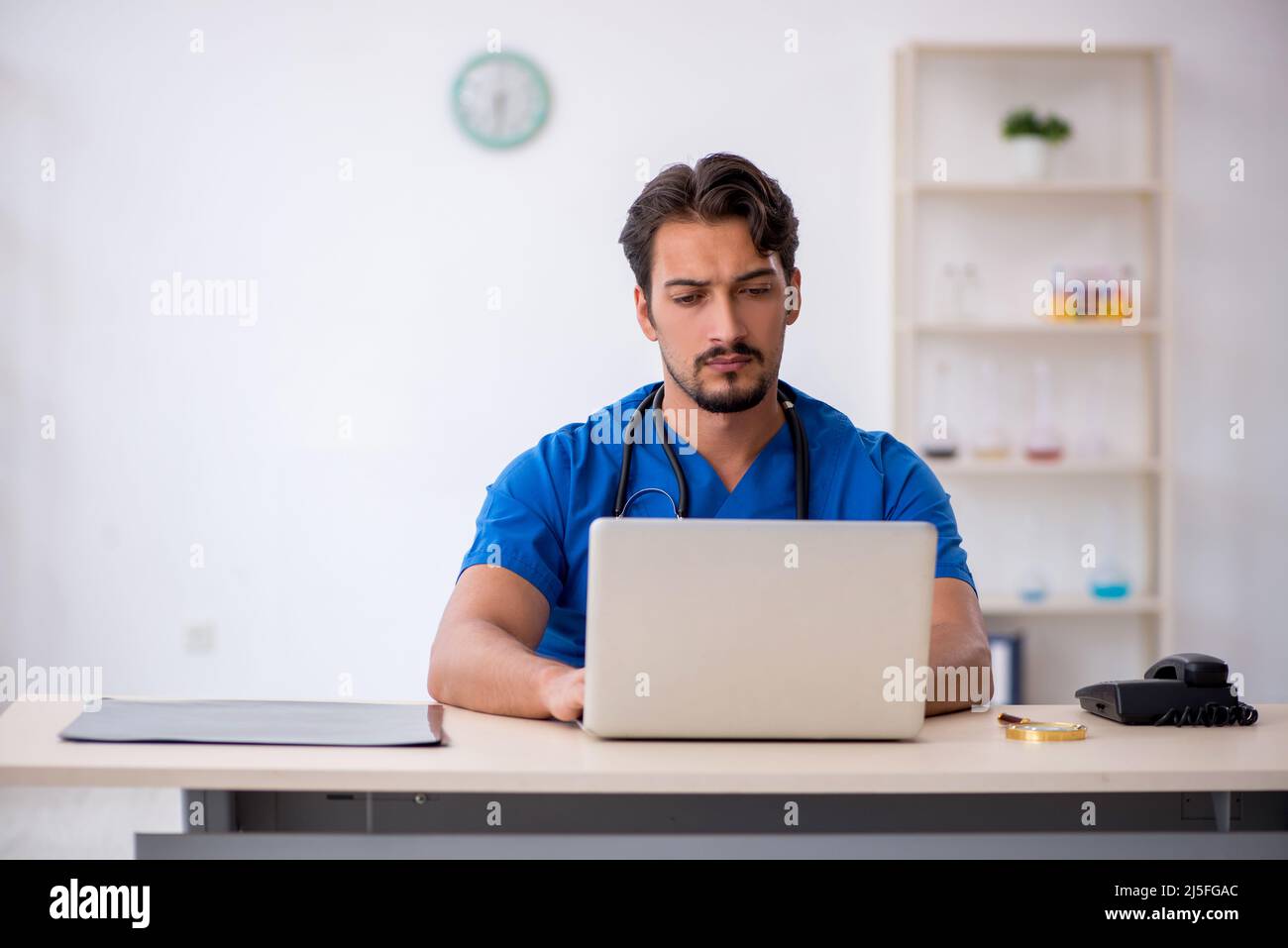 Young doctor working at the hospital Stock Photo - Alamy