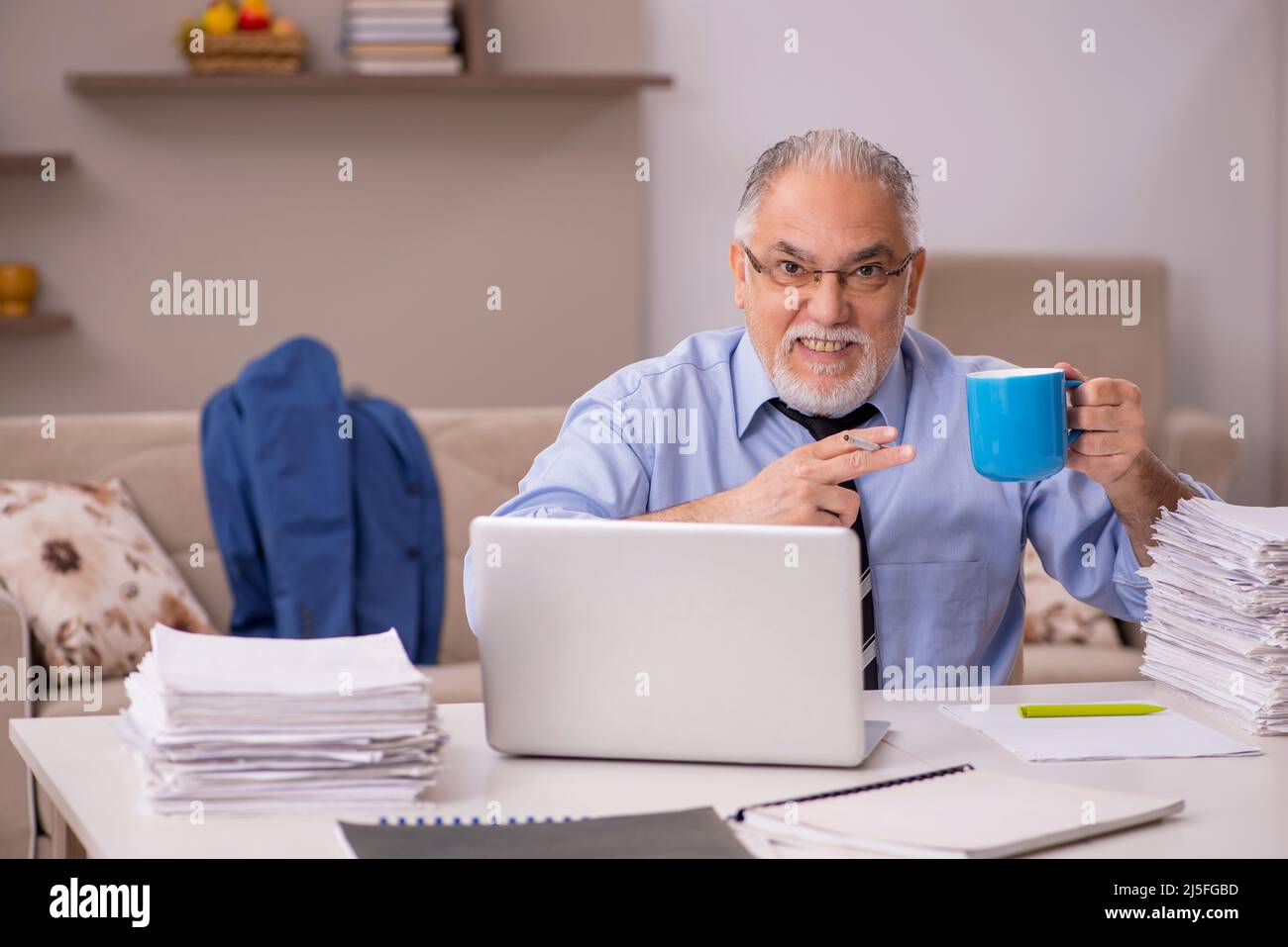 Old boss working from home during pandemic Stock Photo - Alamy