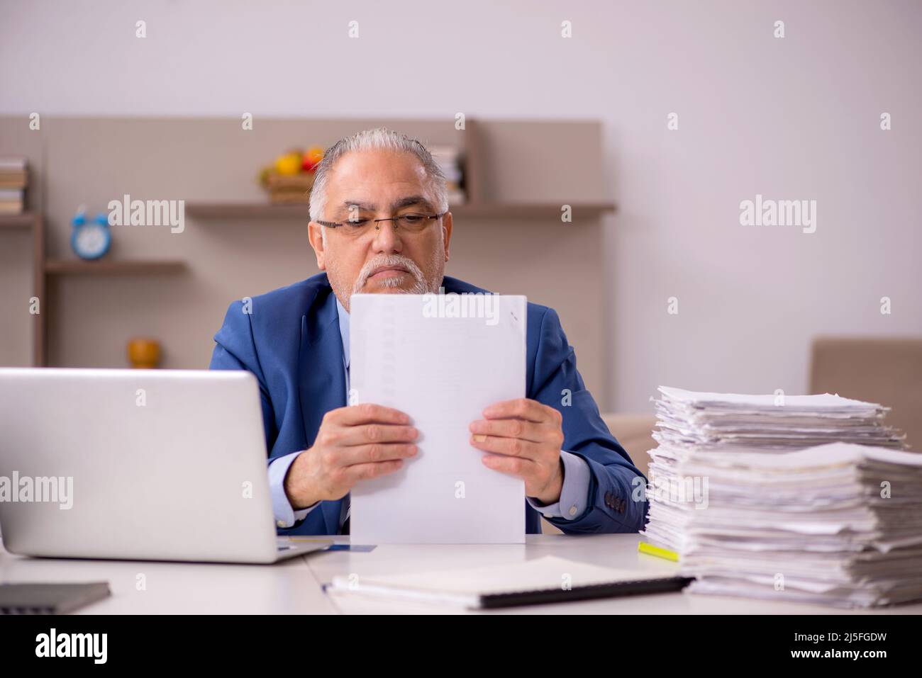 Old boss working from home during pandemic Stock Photo - Alamy