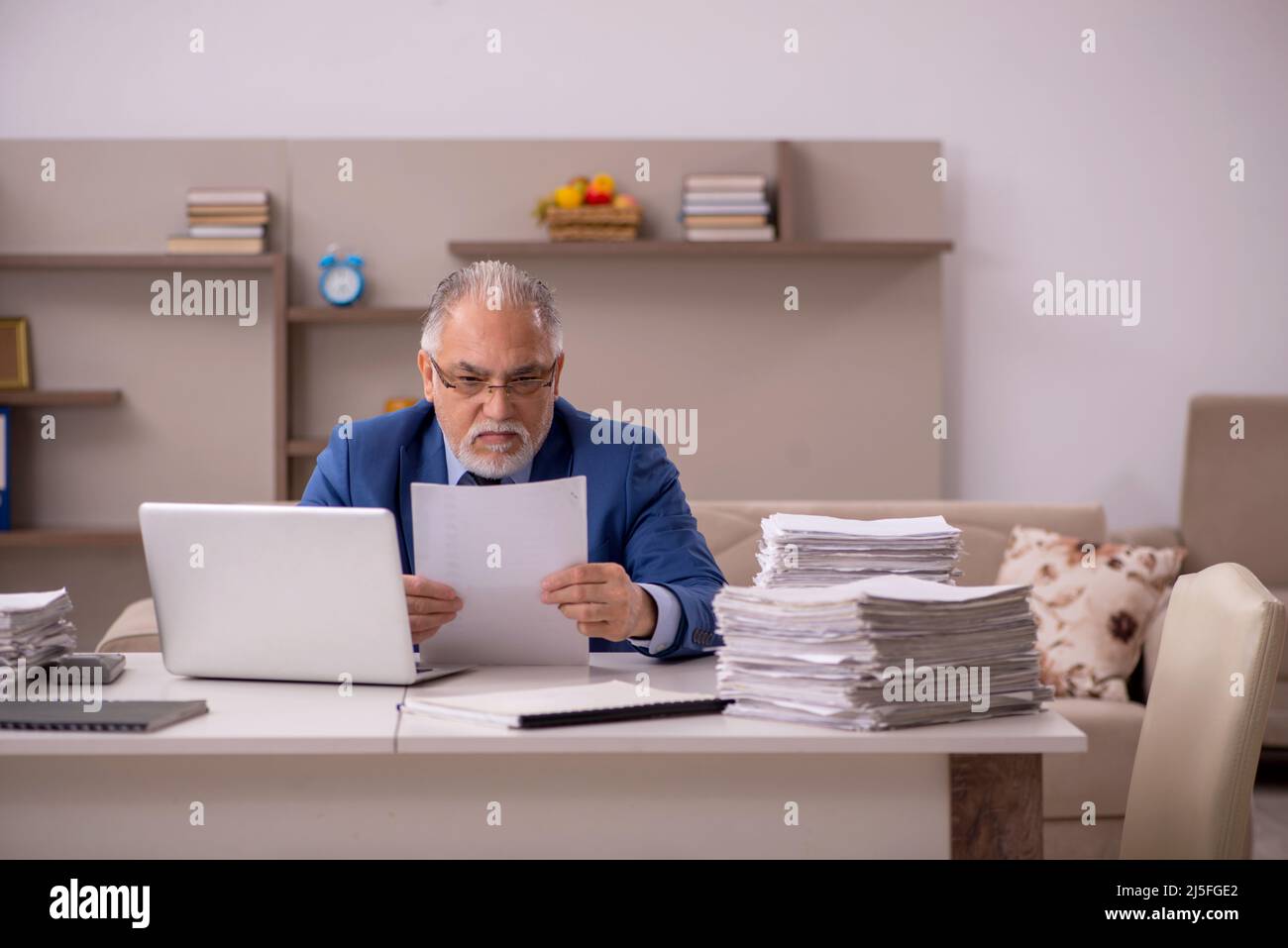 Old boss working from home during pandemic Stock Photo - Alamy
