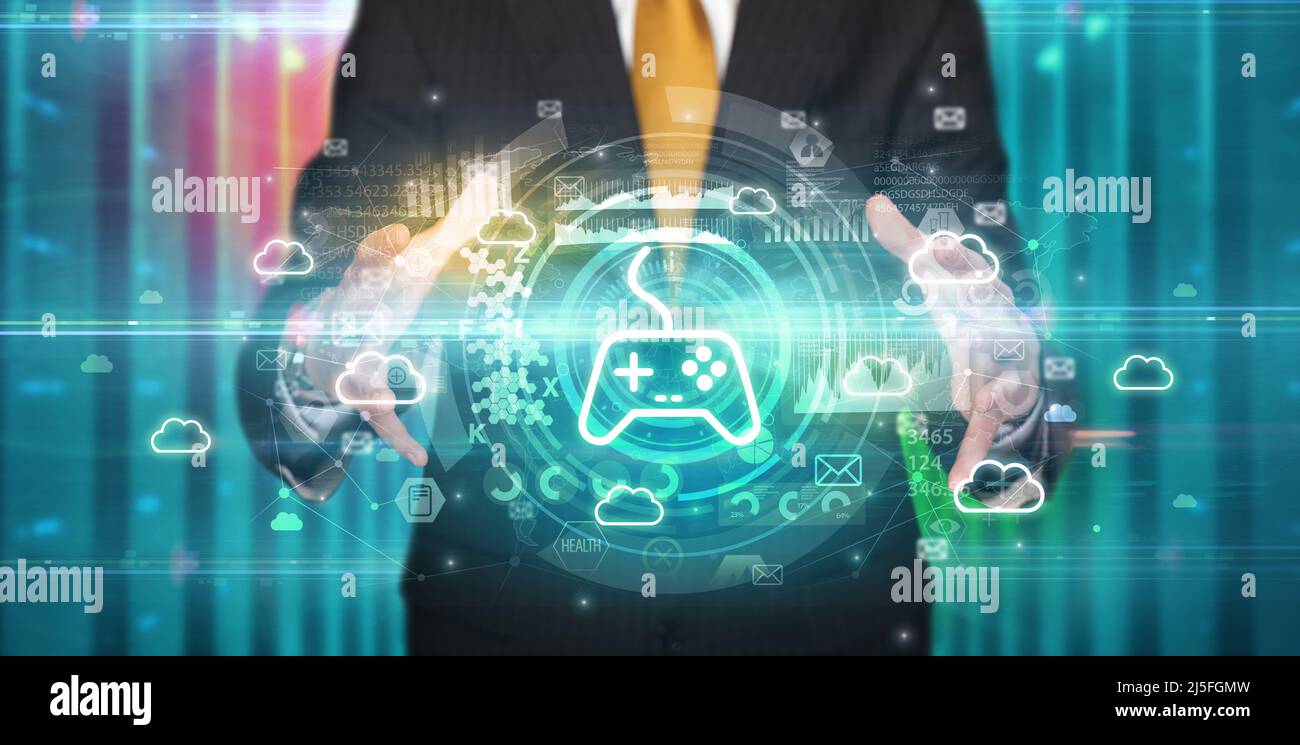 Businessman holding technology icon concept Stock Photo - Alamy