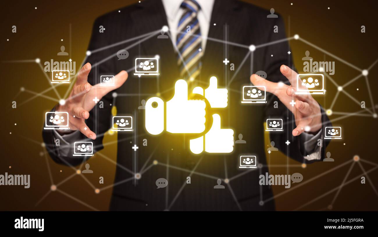 Hand holding social media icons Stock Photo - Alamy