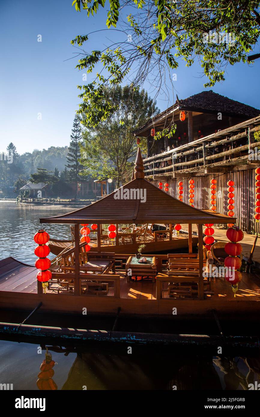 Sunrise with fog over Ban Rak thai, chinese village near a lake in Mae ...