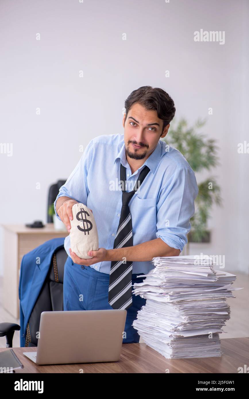 Young businessman employee in remuneration concept Stock Photo - Alamy