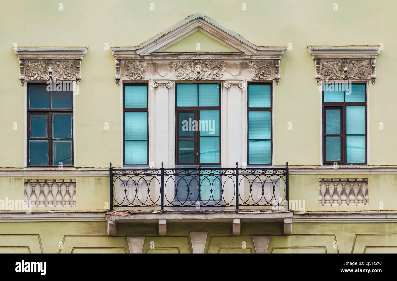 Balcony and several windows in a row on the facade of the urban ...