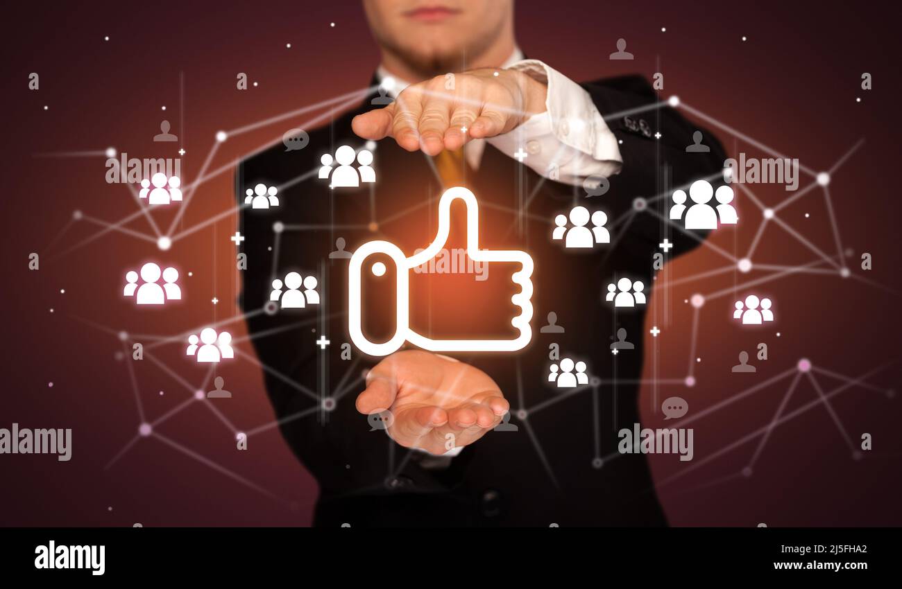 Hand holding social media icons Stock Photo - Alamy