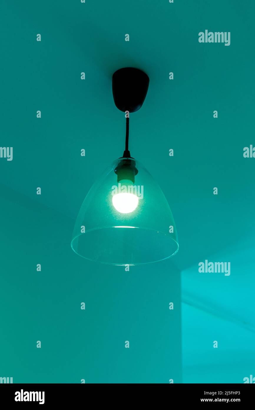Ceiling lamp in blue light. Ceiling lamp Stock Photo - Alamy