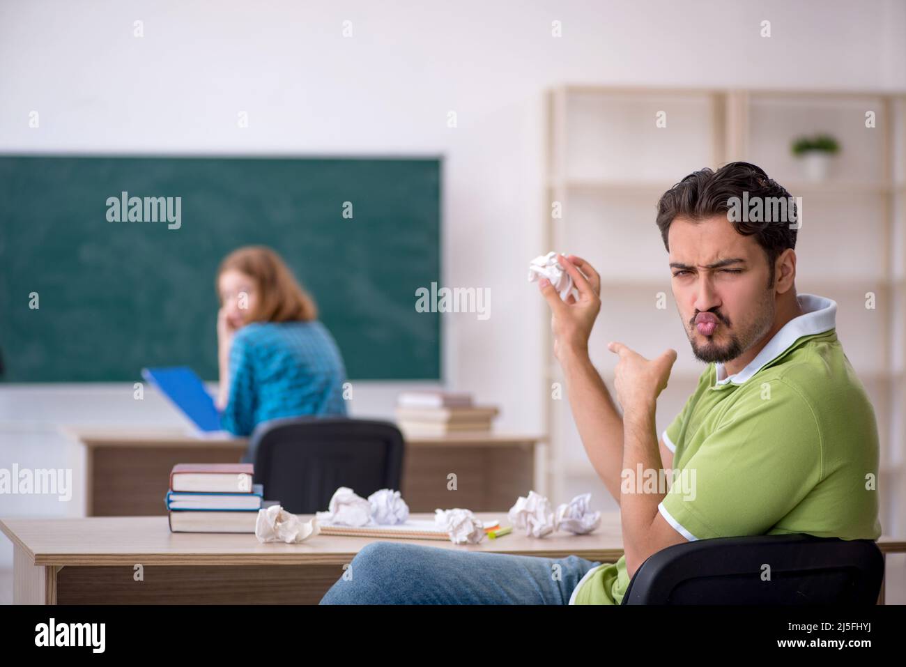 Two students having fun during the lesson Stock Photo - Alamy