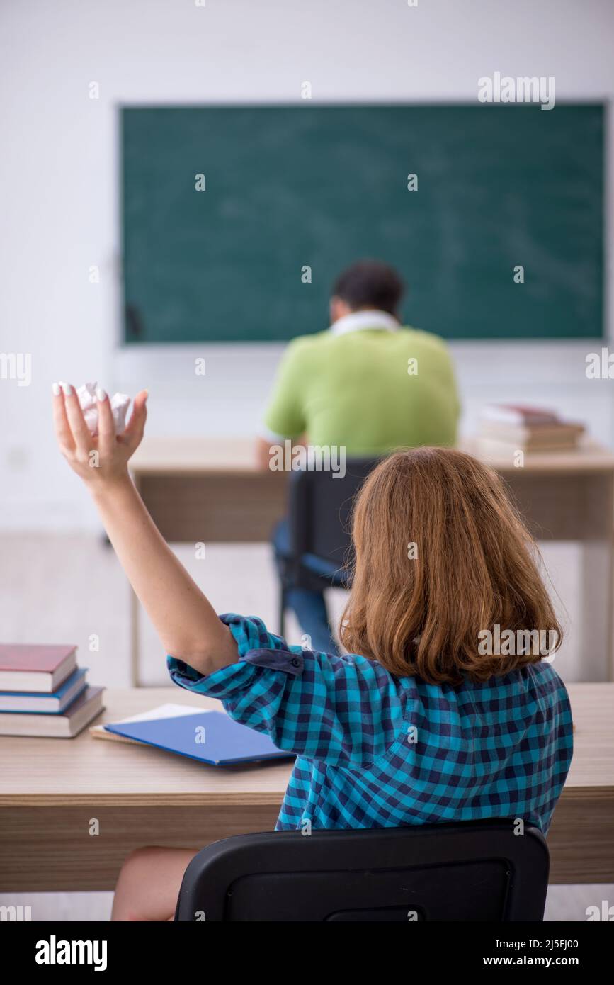 Two students having fun during the lesson Stock Photo - Alamy