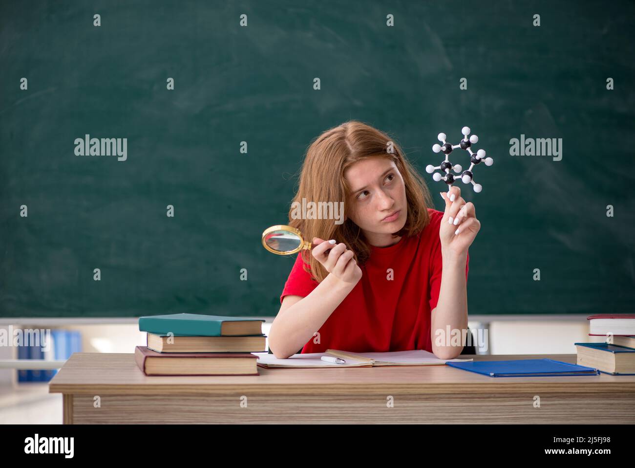 Female student chemist preparing for exams in the classroom Stock Photo ...