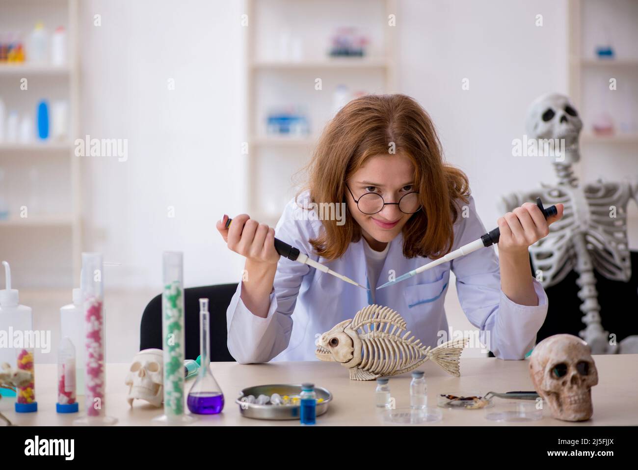 Young female zoologist working at the laboratory Stock Photo - Alamy