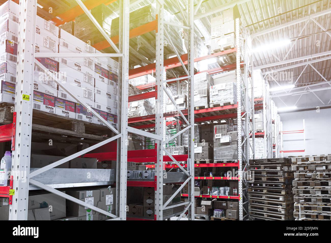 high racks in a logistics warehouse filled with goods Stock Photo - Alamy
