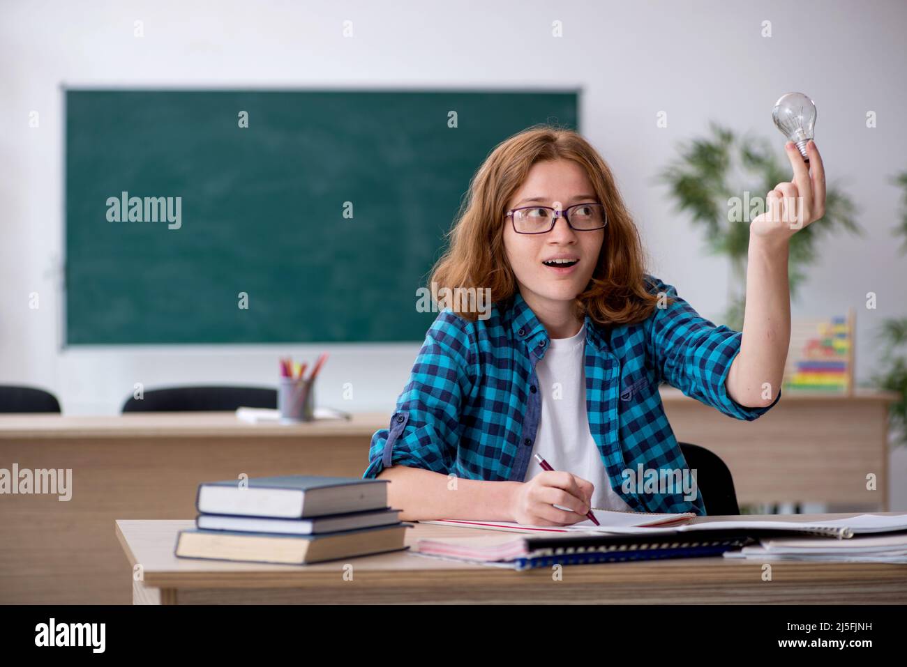 Female student in happy idea concept Stock Photo - Alamy