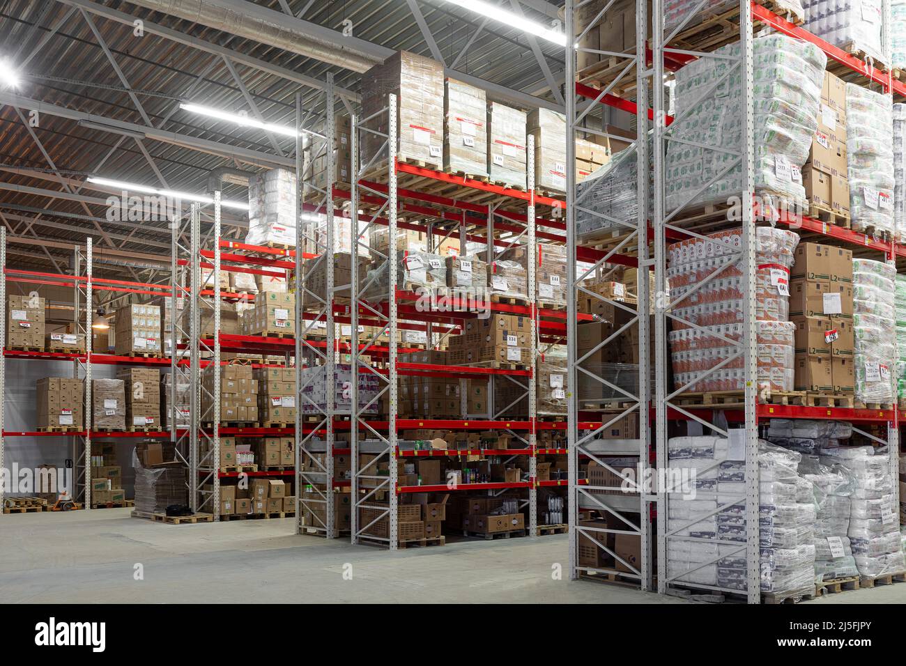 warehouse center with high racks designed to store goods before sending ...
