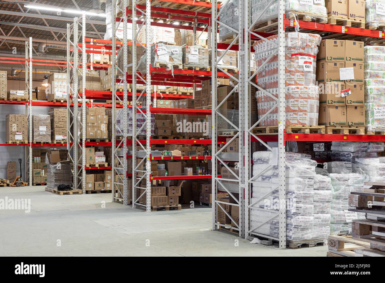 large warehouse with aluminum shelving system and cardboard boxes Stock ...