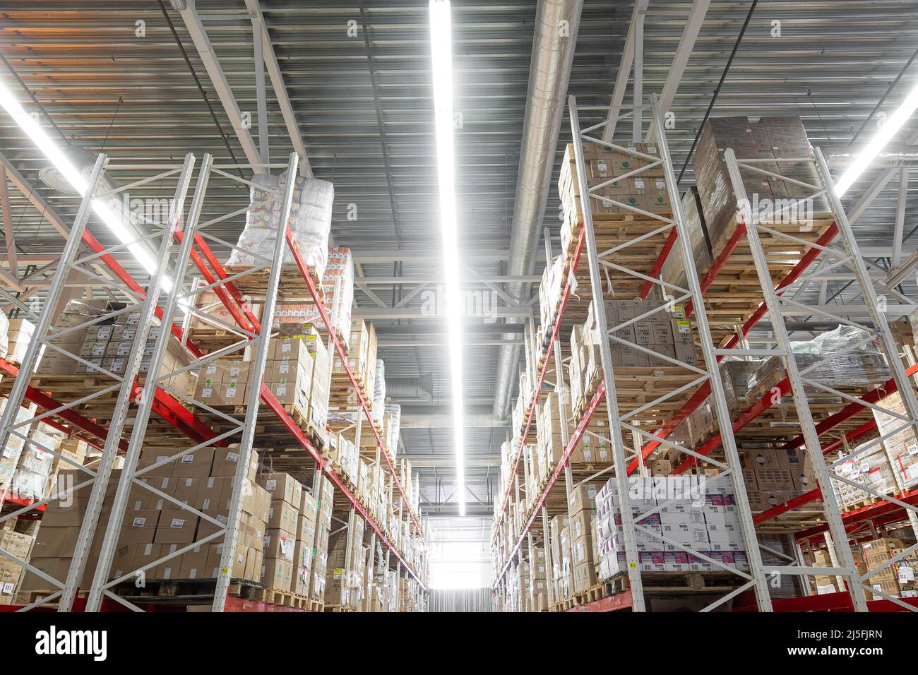 warehouse center with high racks for storing goods Stock Photo - Alamy