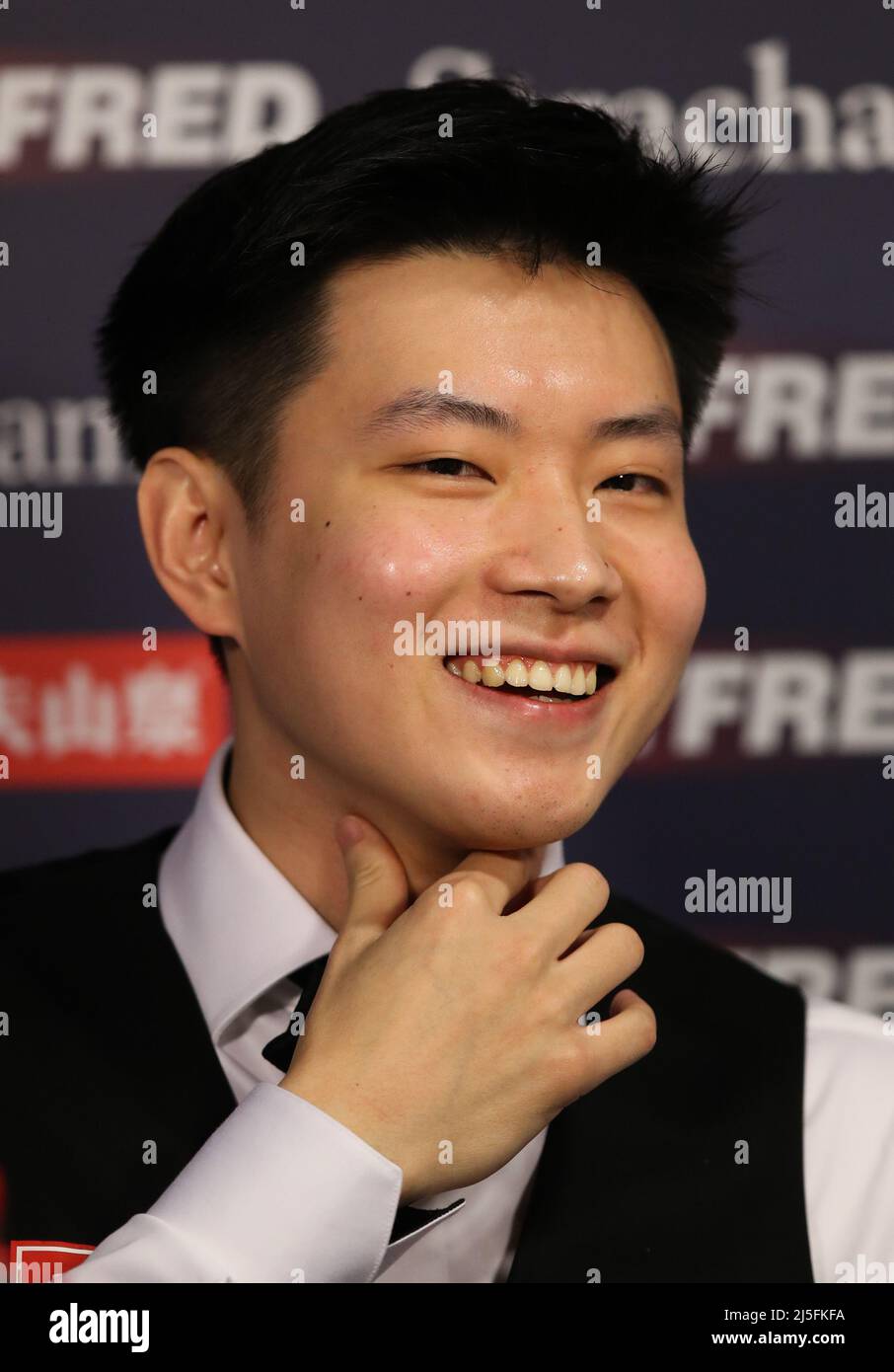 Zhao Xintong is interviewed during day eight of the Betfred World ...