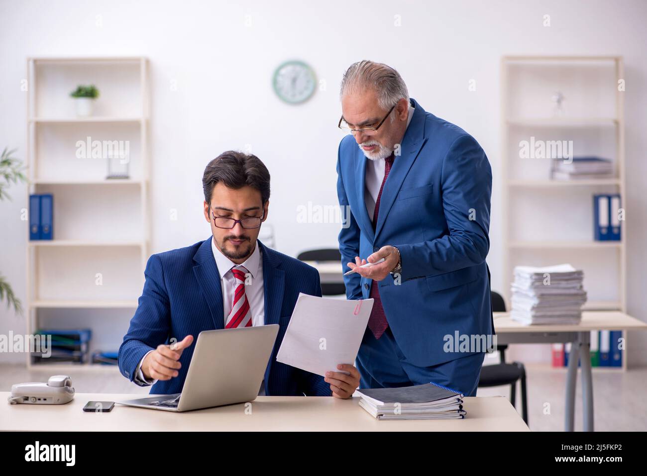 Two colleagues working in the office Stock Photo - Alamy
