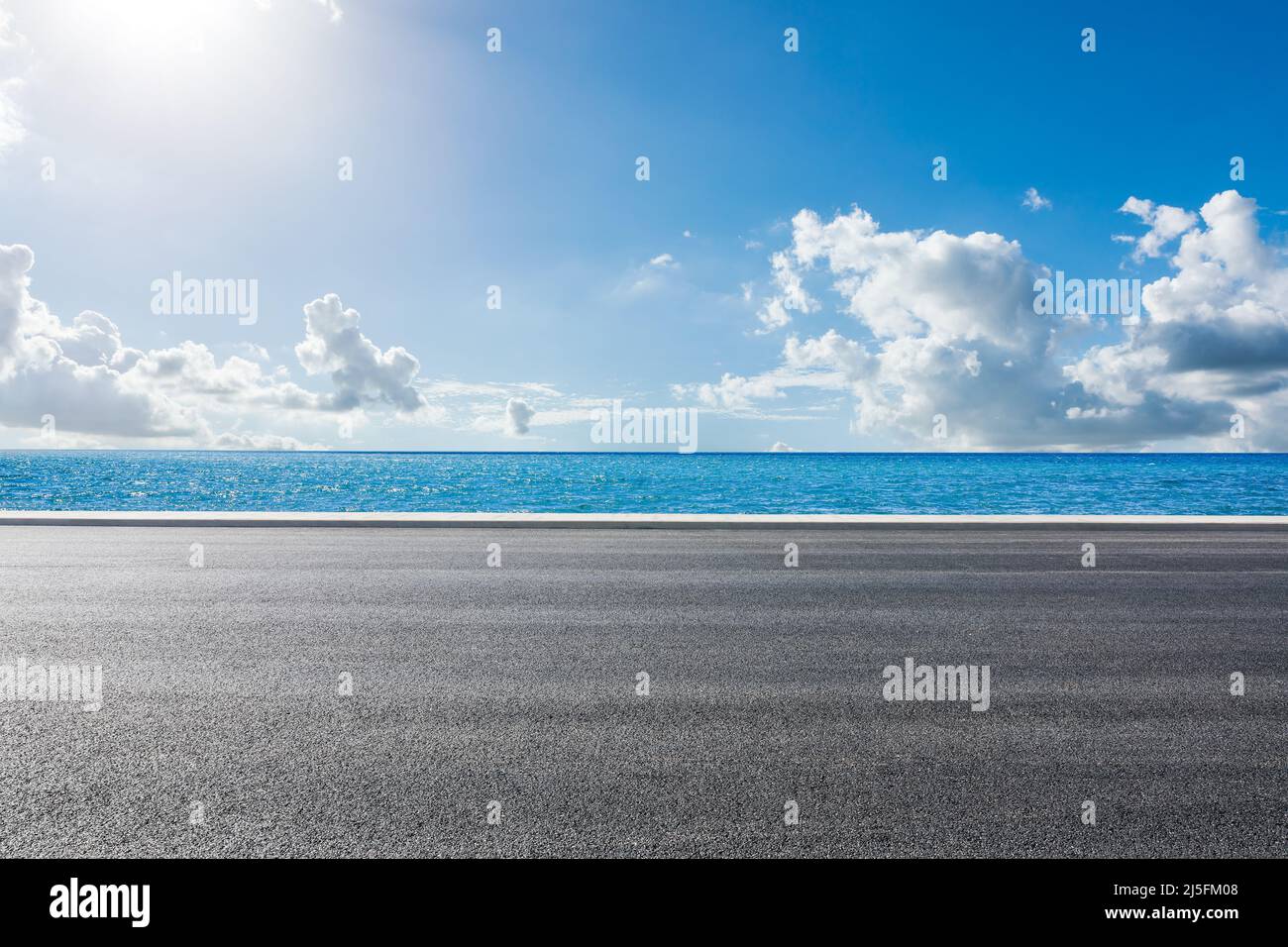 Empty asphalt road near sea hi-res stock photography and images - Alamy