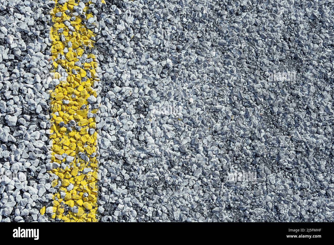 Asphalt texture with yellow markings, close-up Stock Photo - Alamy