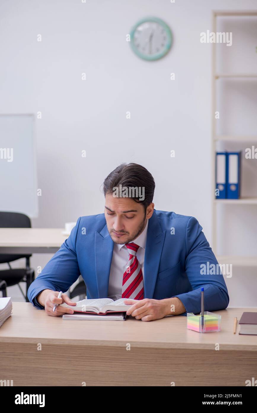Young man handbook office hi-res stock photography and images - Alamy