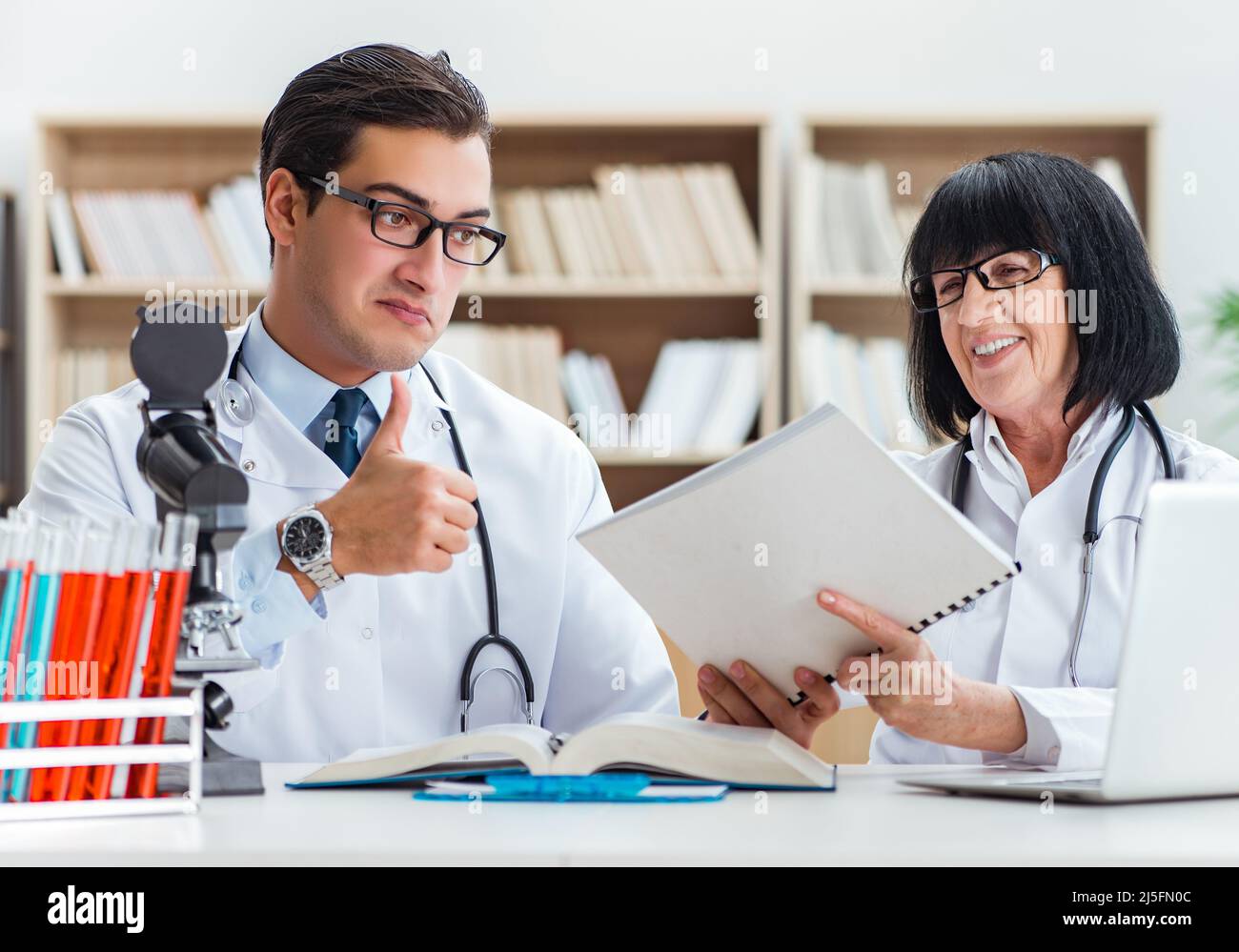 The two doctors working in the lab Stock Photo - Alamy