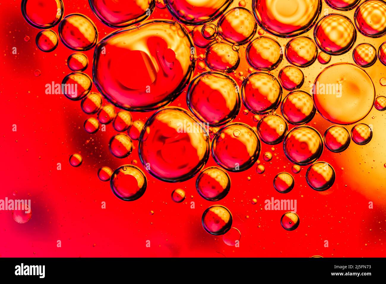 Abstract colorful backdrop with oil drops and waves on water surface ...