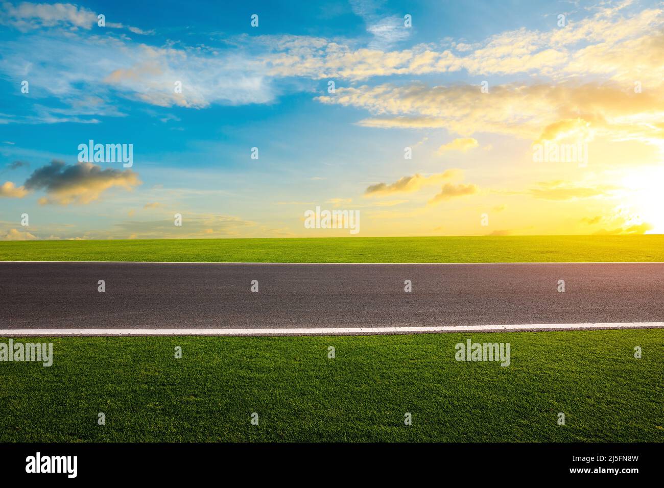 Road with green grass hi-res stock photography and images - Alamy