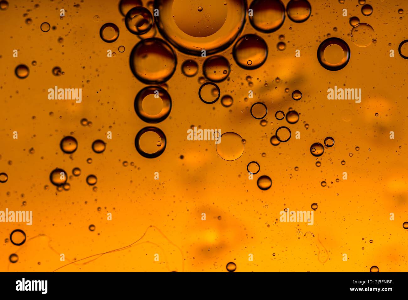 Abstract colorful backdrop with oil drops and waves on water surface ...