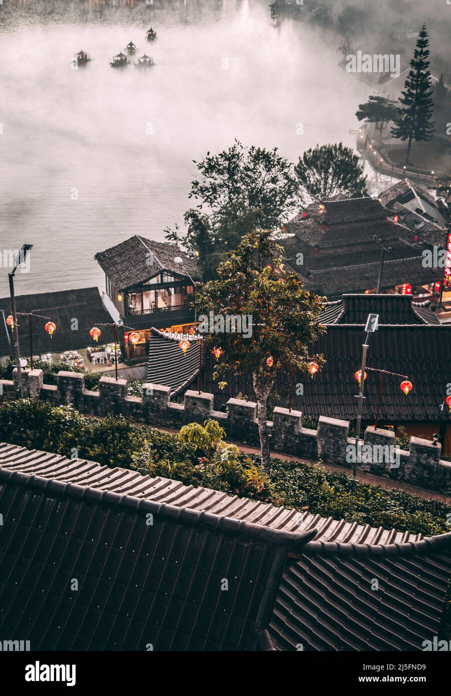 Sunrise with fog over Ban Rak thai, chinese village near a lake in Mae ...