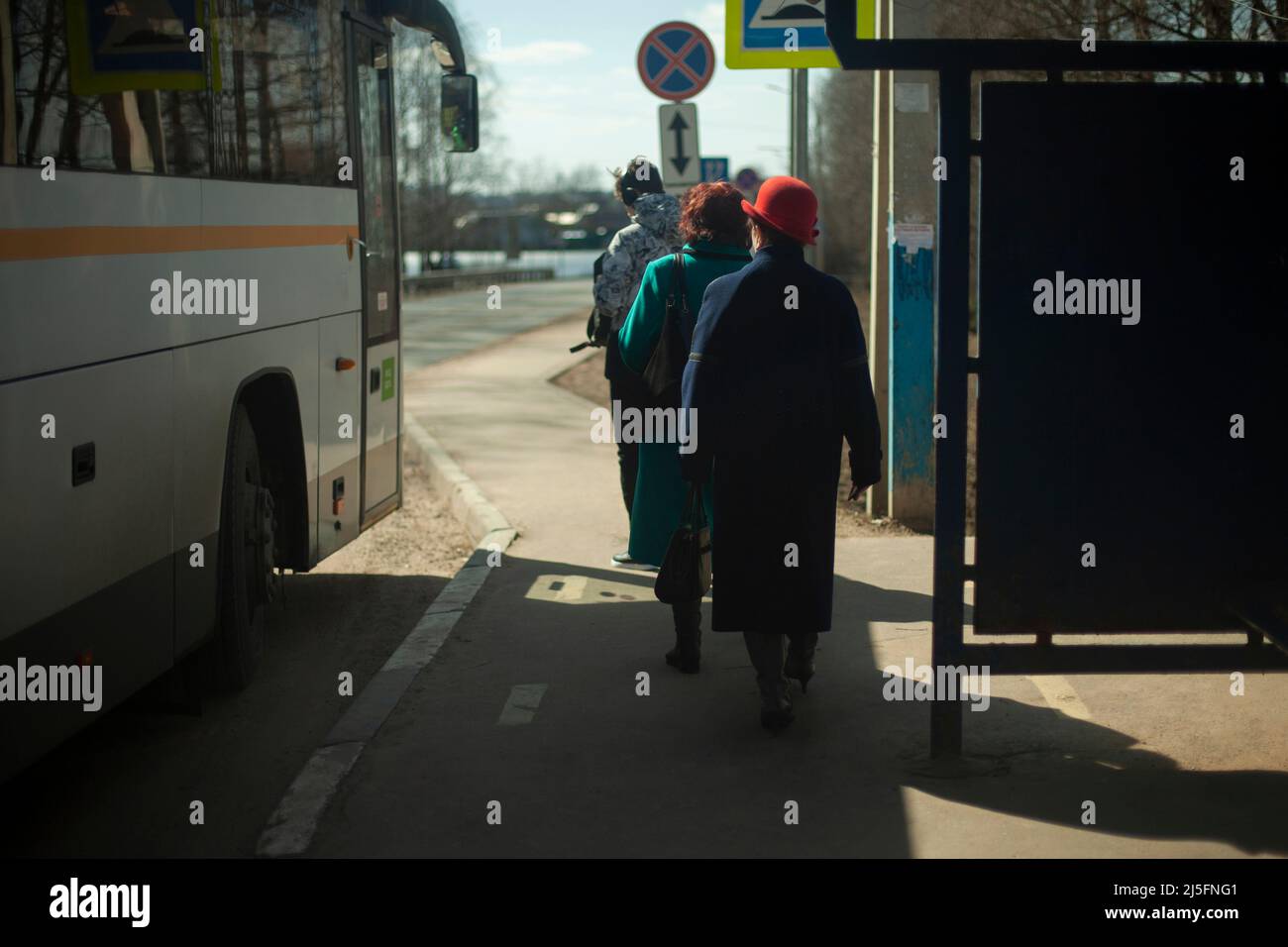 Passengers at the bus stop. People get into transport. People in Russia ...