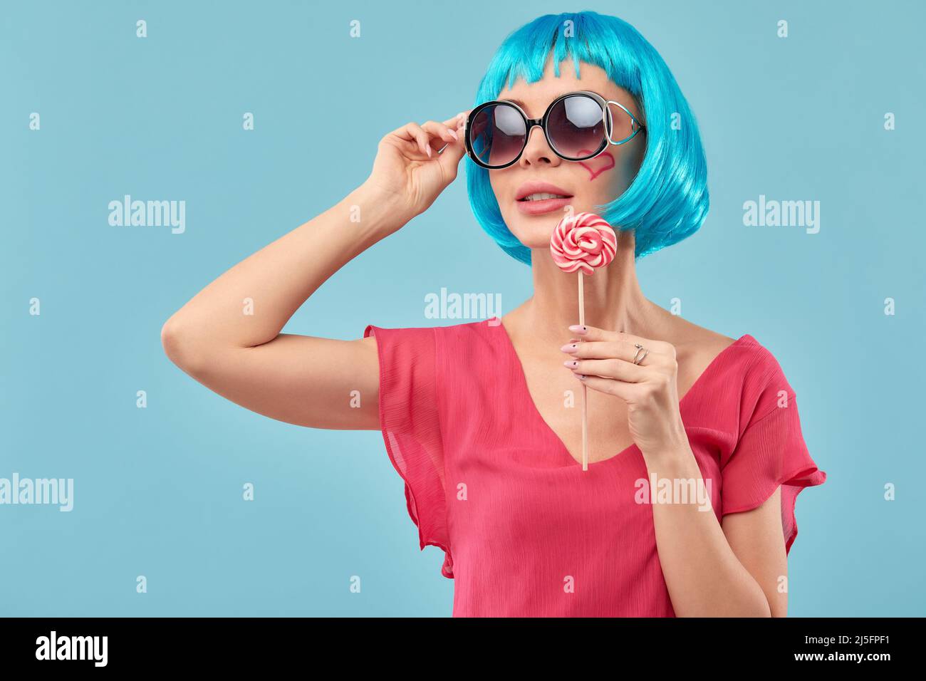 Candy Lolli pop Party Girl posing in blue studio. Role-playing games ...