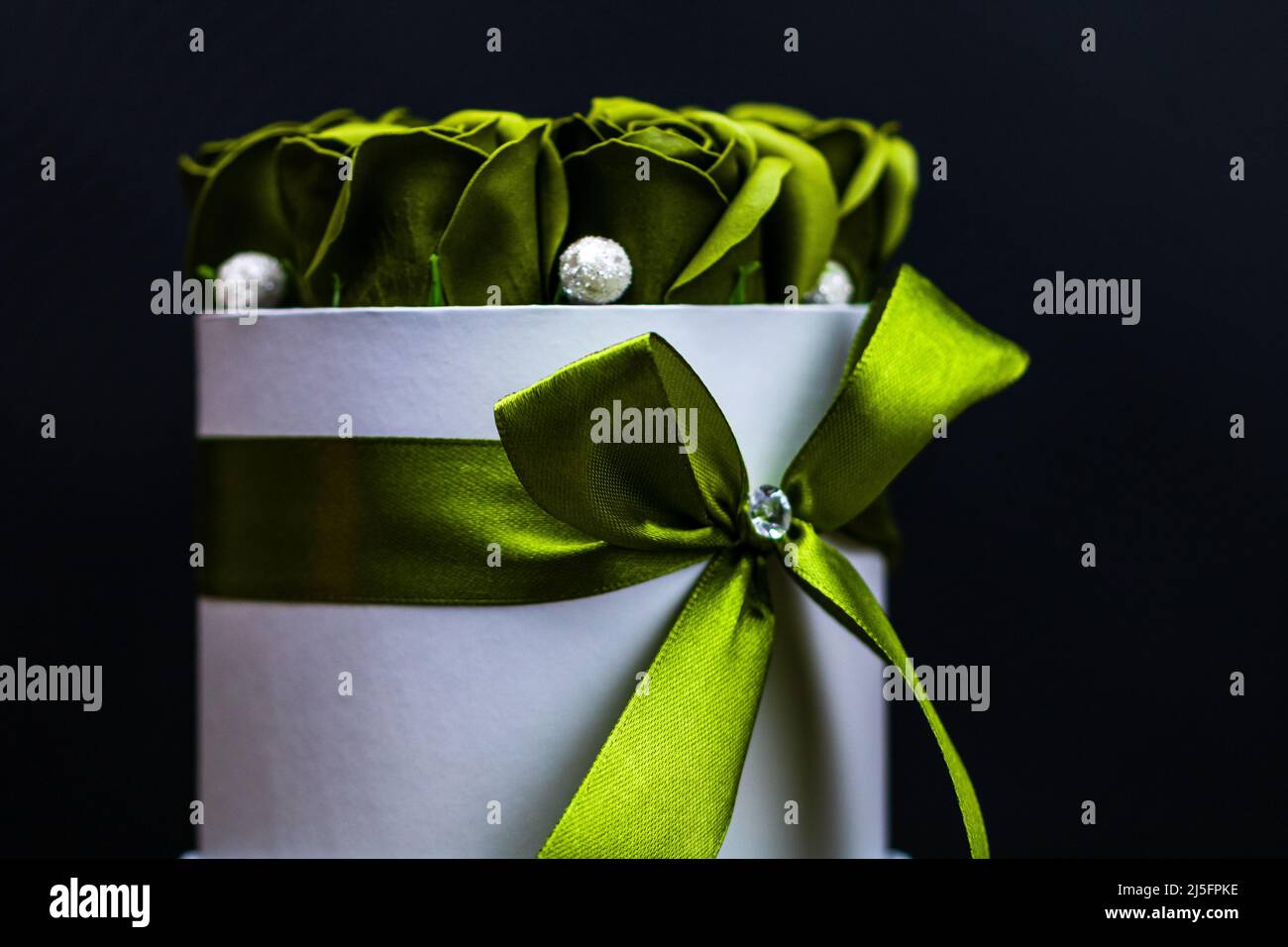 Green roses in a round luxury present box. Bouquet of flowers in a ...