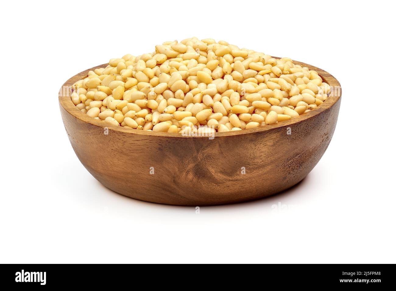 Wooden bowl with peeled pine nuts isolated on white background Stock ...