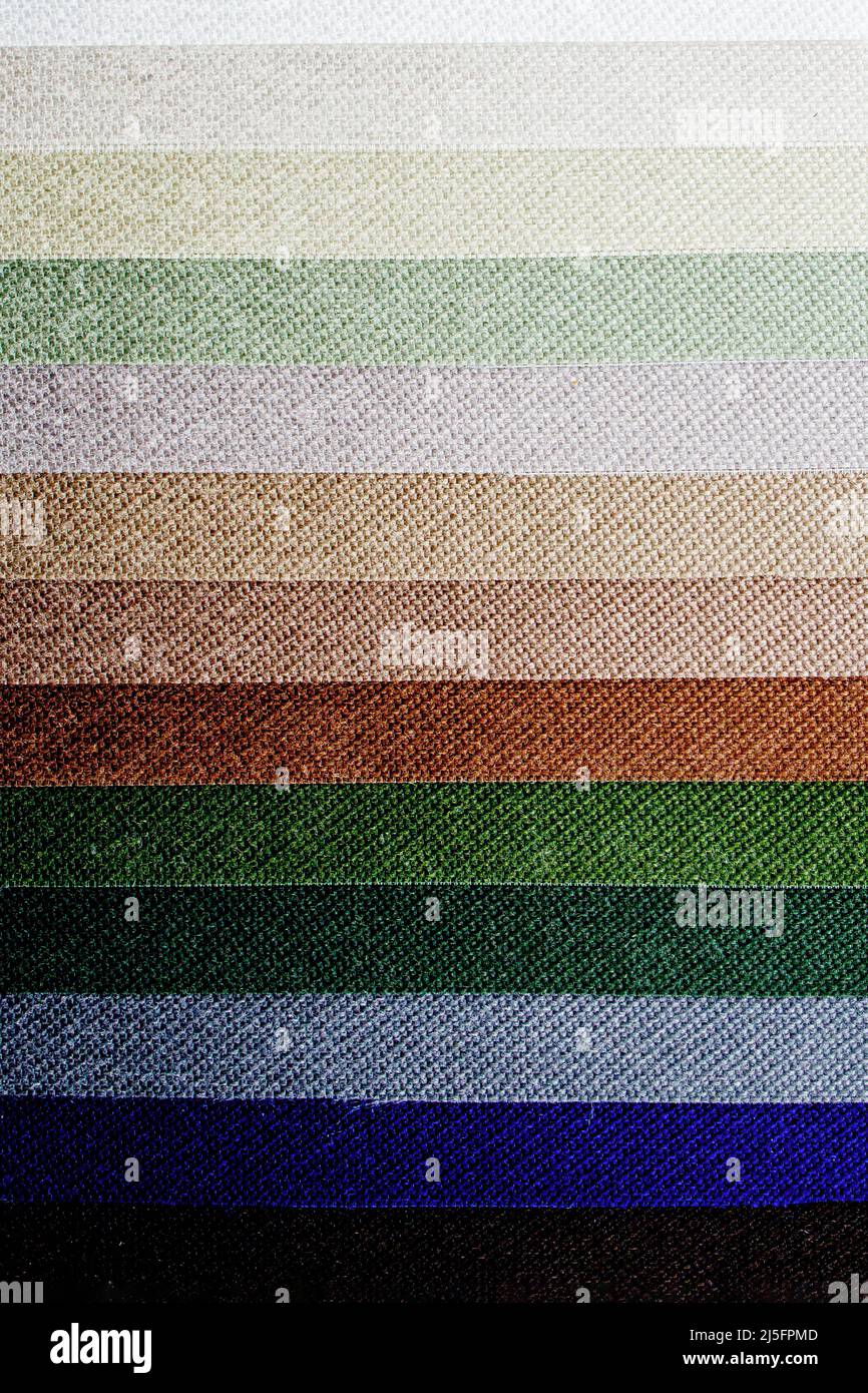 Multicolored fabric background. Variety of color of dense fabric. Color ...