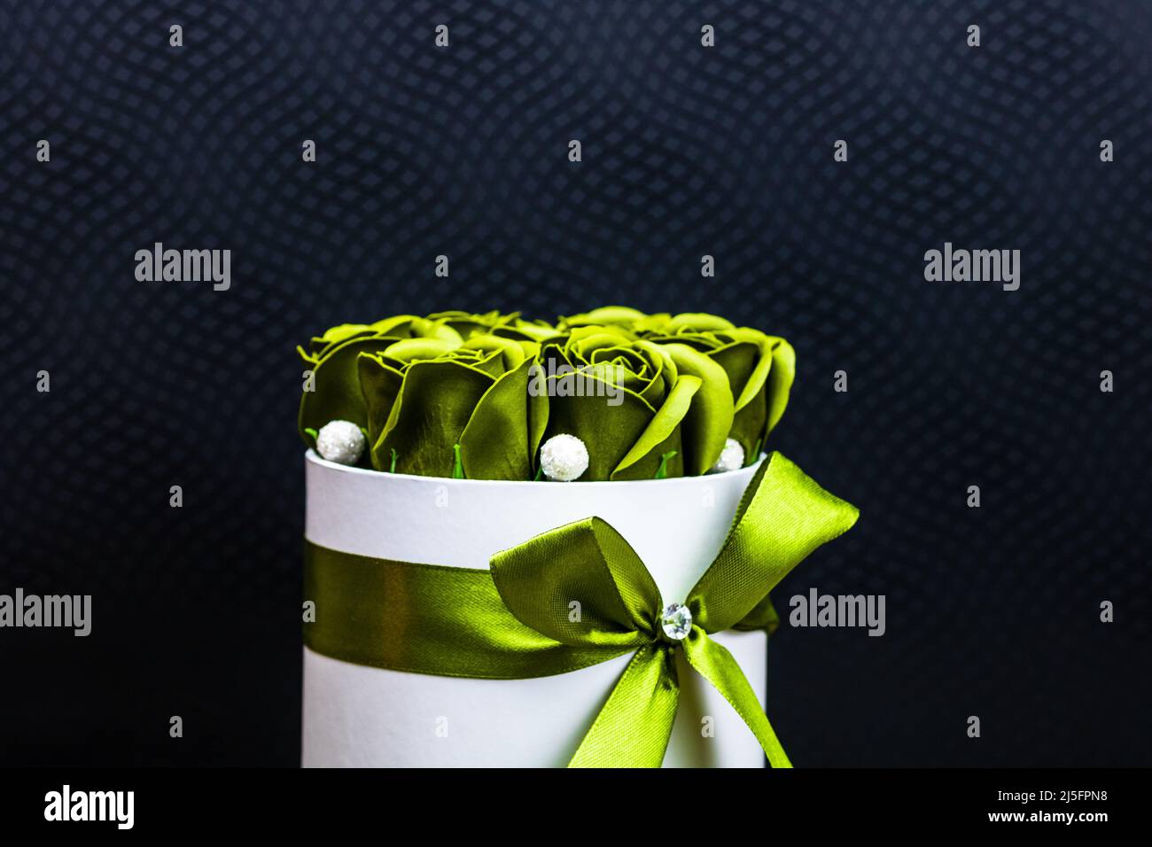 Green roses in a round luxury present box. Bouquet of flowers in a ...