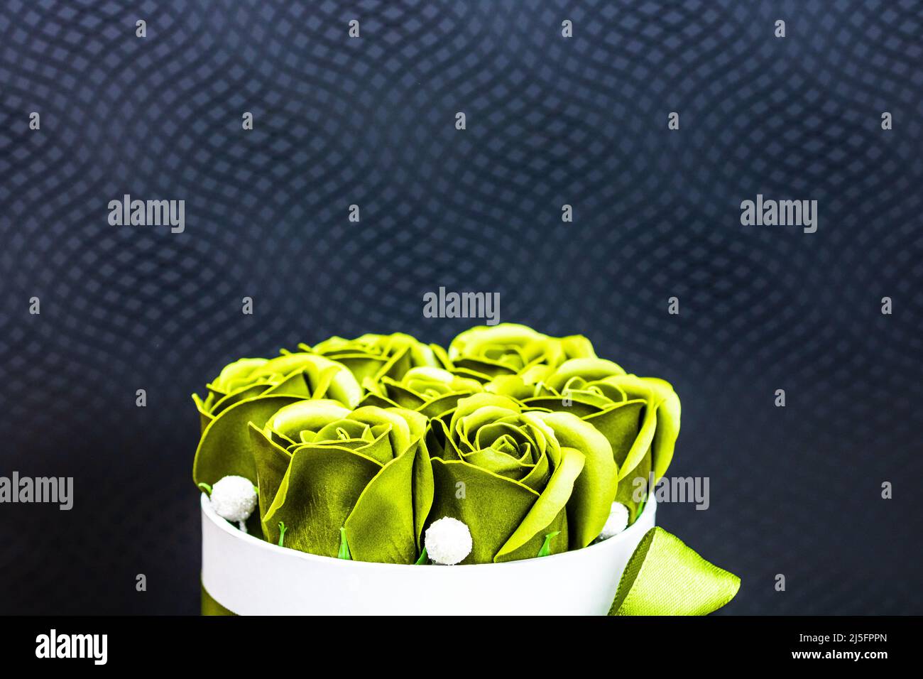 Green roses in a round luxury present box. Bouquet of flowers in a ...